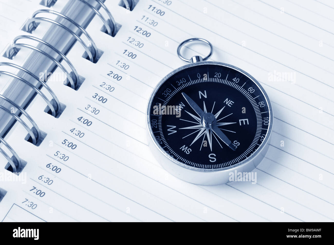 Calendar agenda and compass, concept of time Planning Stock Photo - Alamy