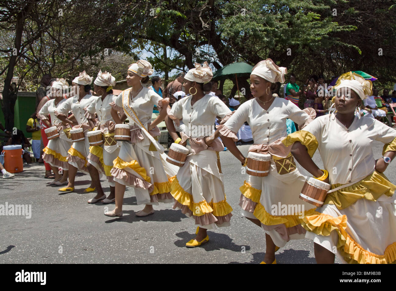 Participants dancing in Harvest Festival Parade with colorful costume ...