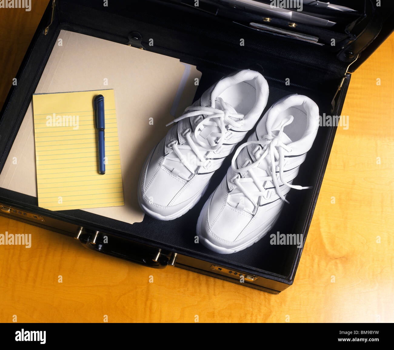 Open Briefcase with running shoes inside Stock Photo - Alamy