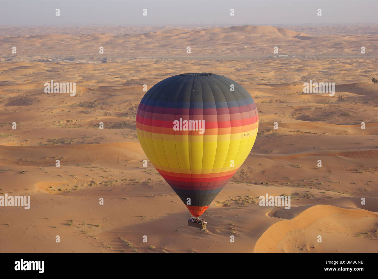 Hot air balloon adventures flying over the desert Stock Photo - Alamy