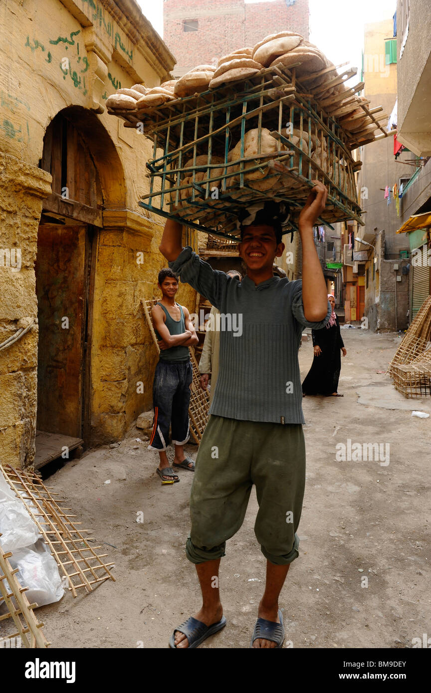 Boy carrying basket on head hi-res stock photography and images - Alamy