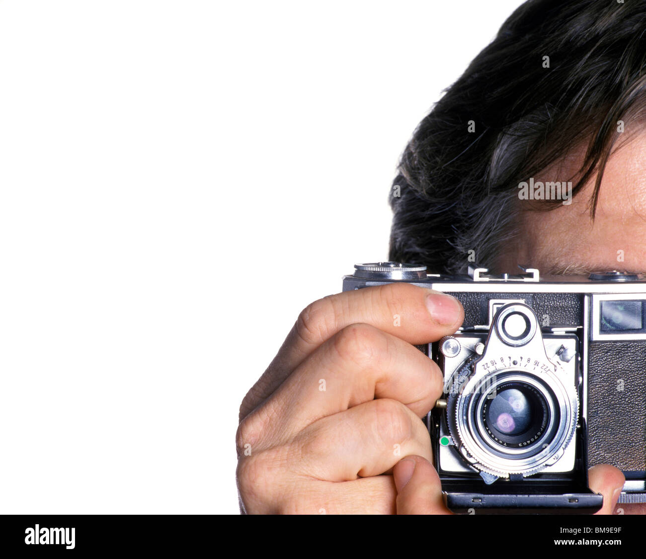Man with camera taking a picture Stock Photo - Alamy