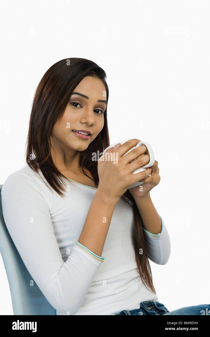Woman drinking coffee Stock Photo - Alamy
