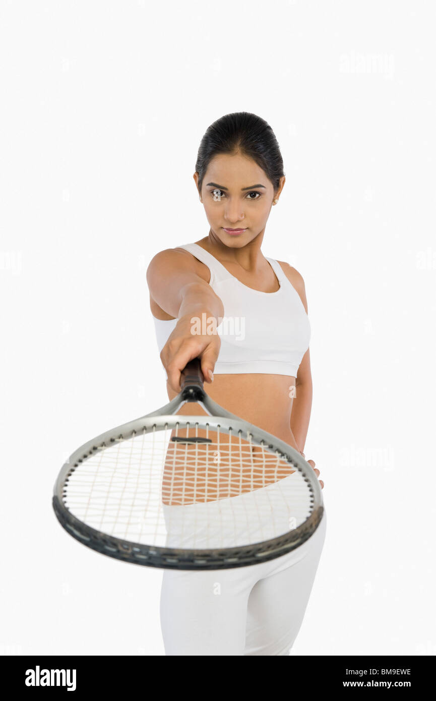 Portrait of a woman holding a tennis racket Stock Photo - Alamy