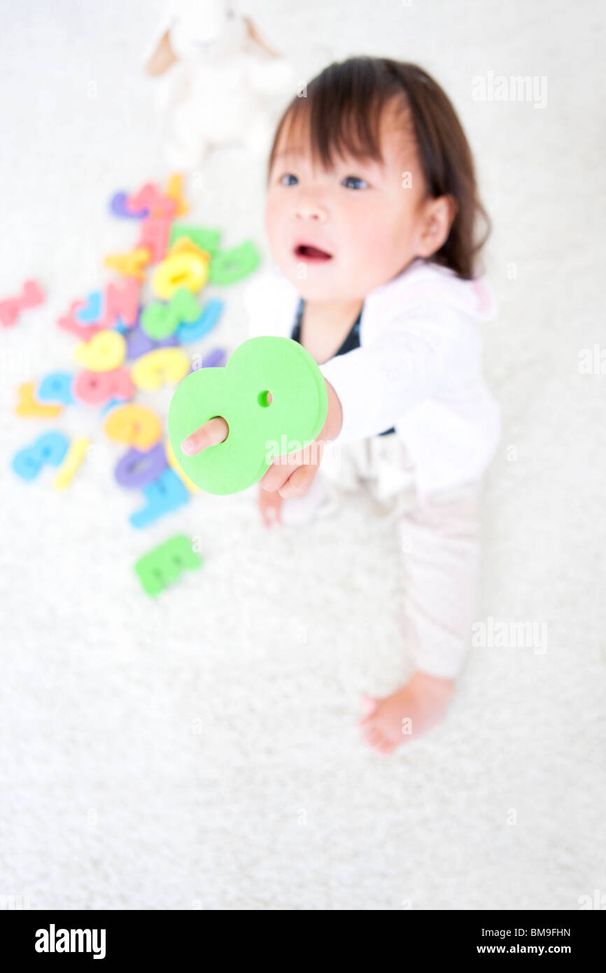 Baby holding number 2 hi-res stock photography and images - Alamy