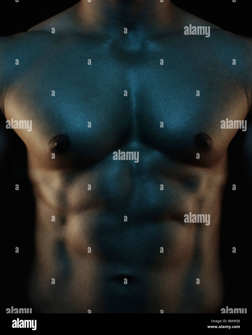 Mid section view of a muscular man showing his abs Stock Photo - Alamy
