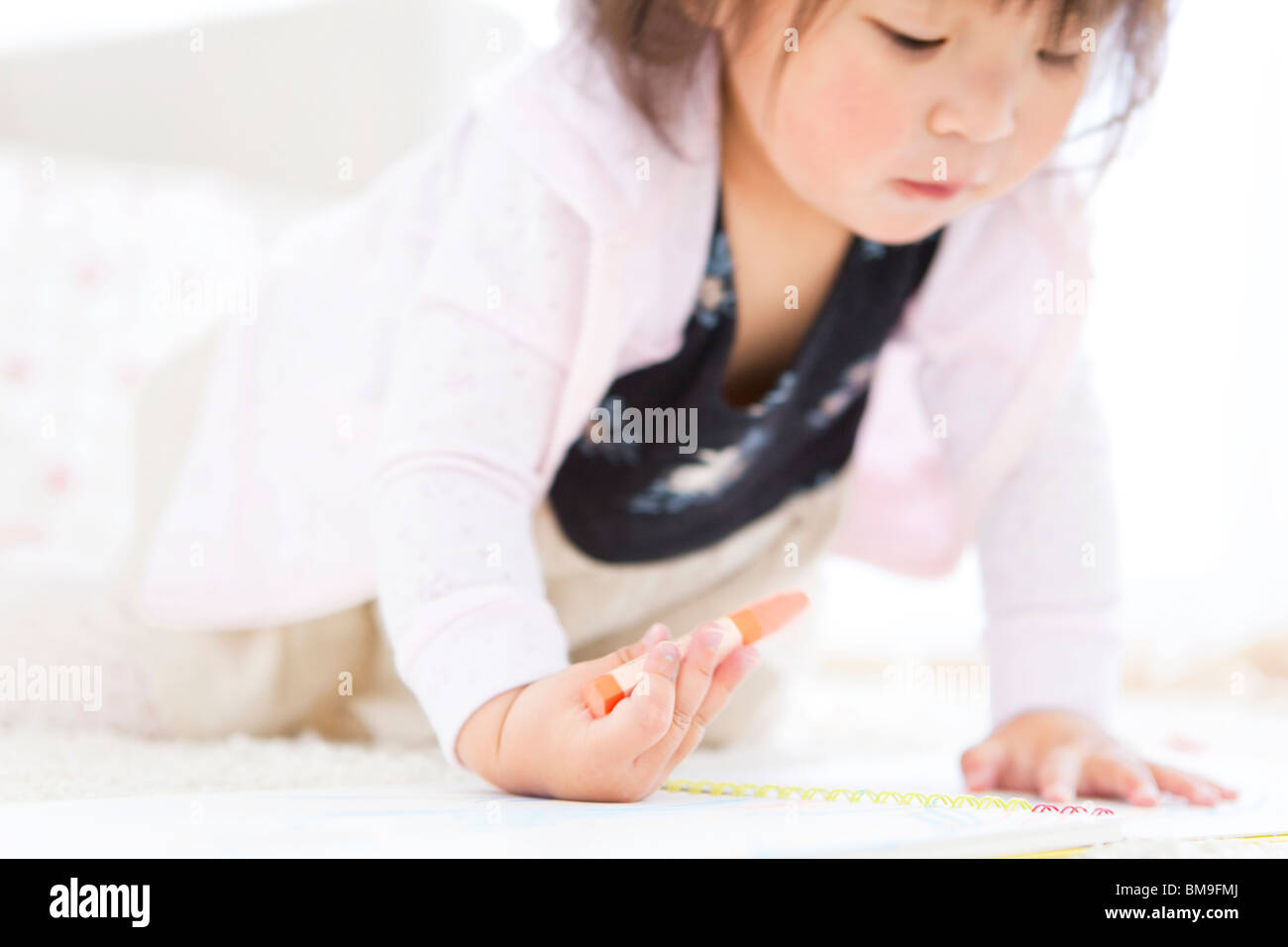 Baby girl drawing on sketch pad Stock Photo - Alamy