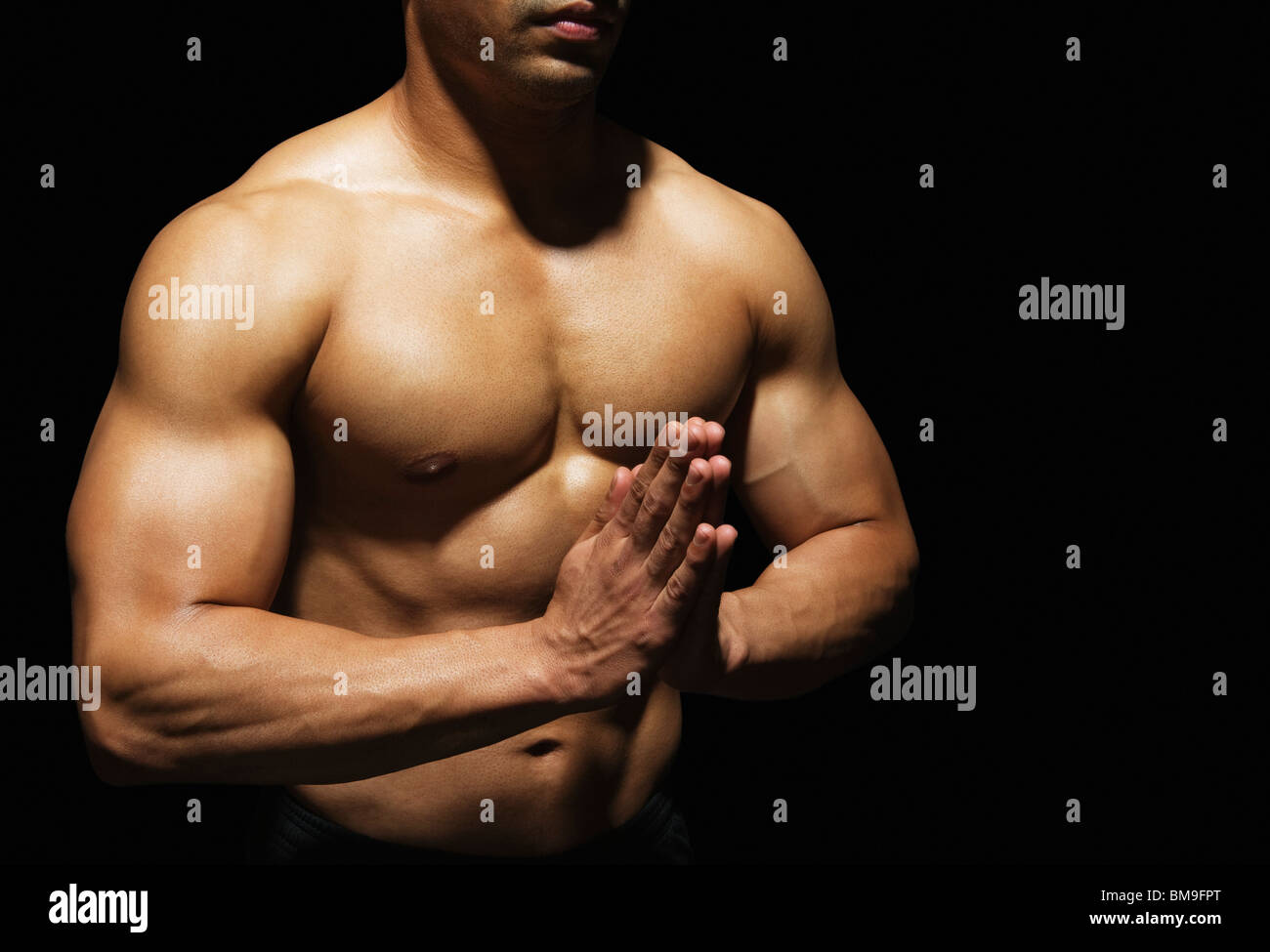 Close-up of a muscular man meditating Stock Photo - Alamy