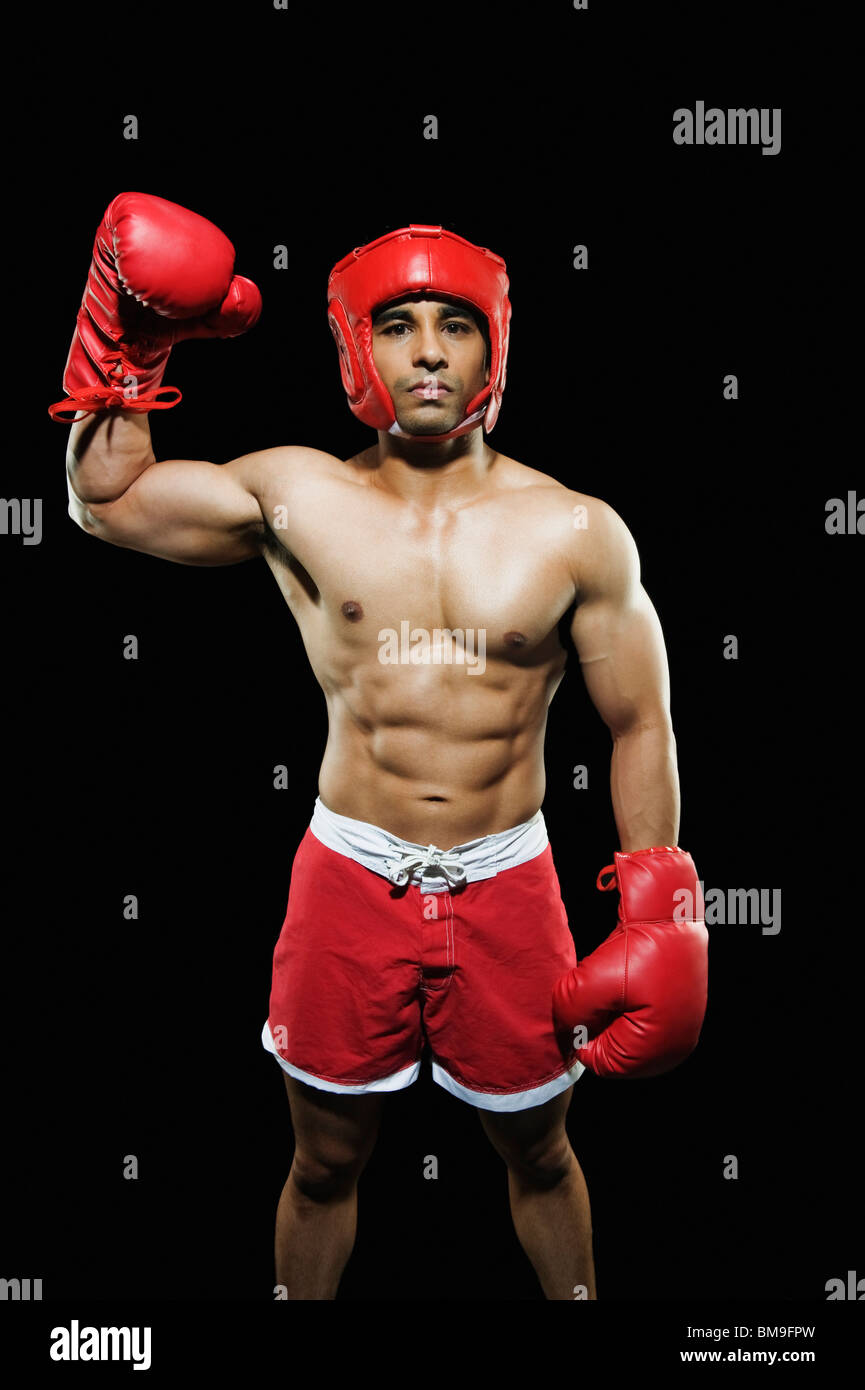 Portrait of a male boxer flexing muscles Stock Photo - Alamy