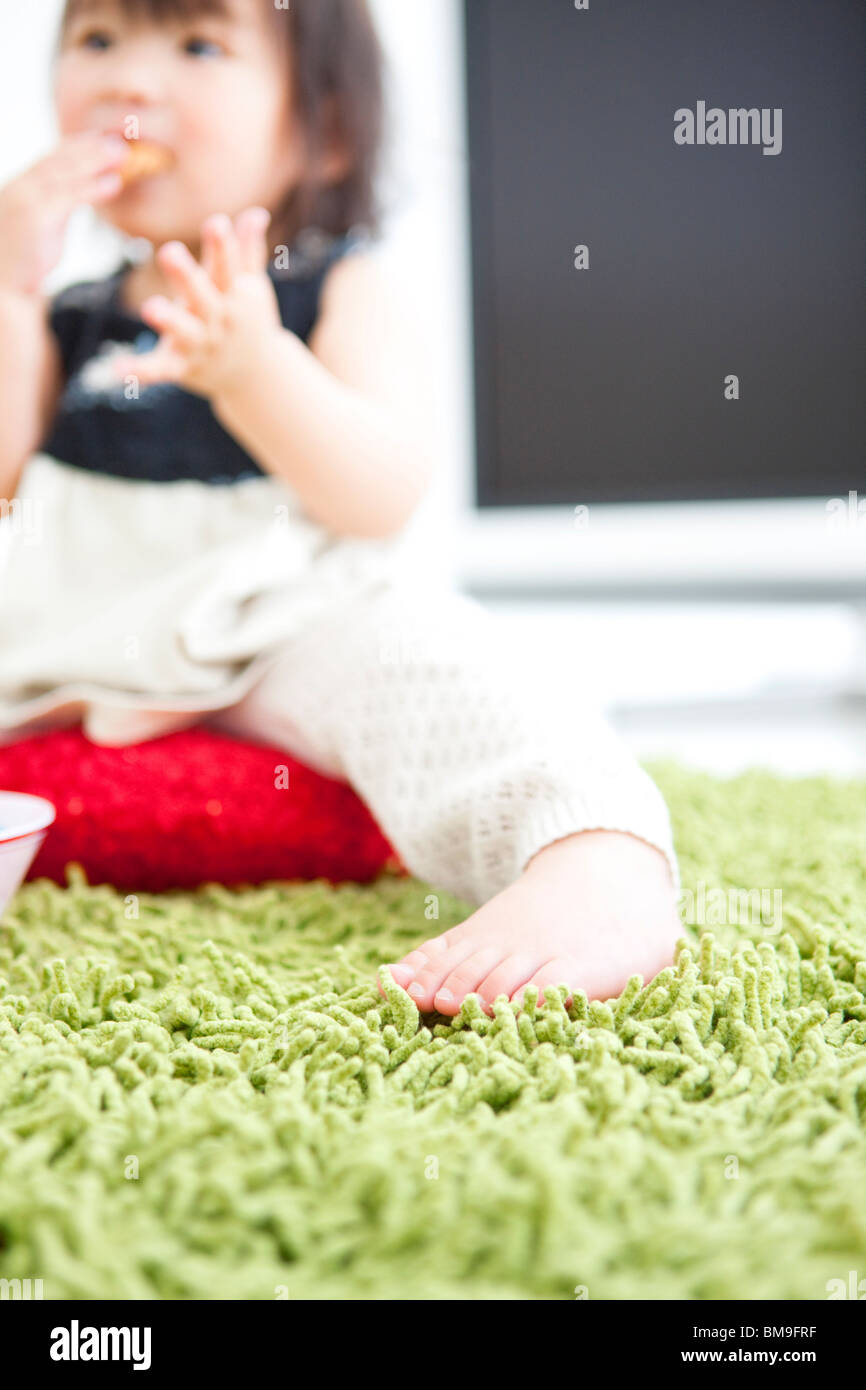 Baby eating foot hi-res stock photography and images - Alamy