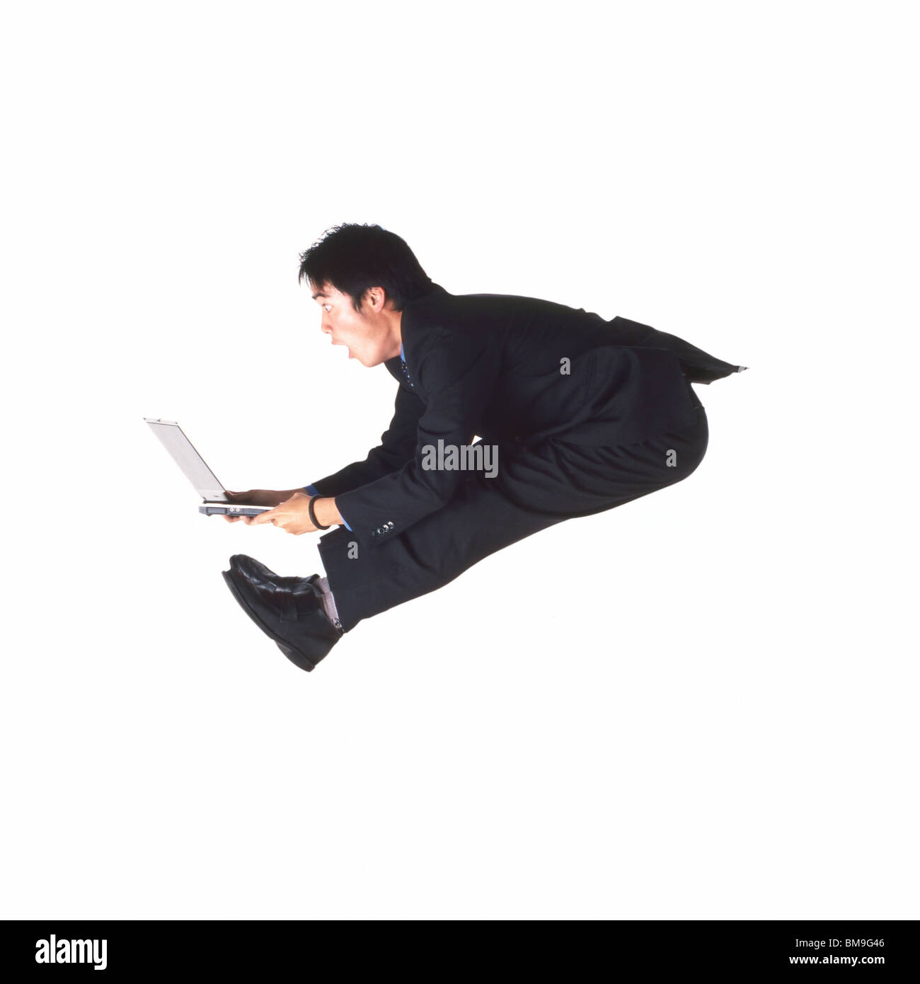 Man jumping using laptop hi-res stock photography and images - Alamy