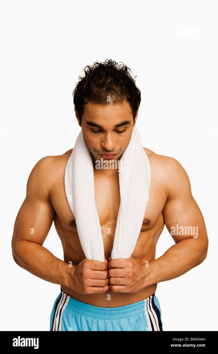 Man standing with a towel around his neck Stock Photo - Alamy