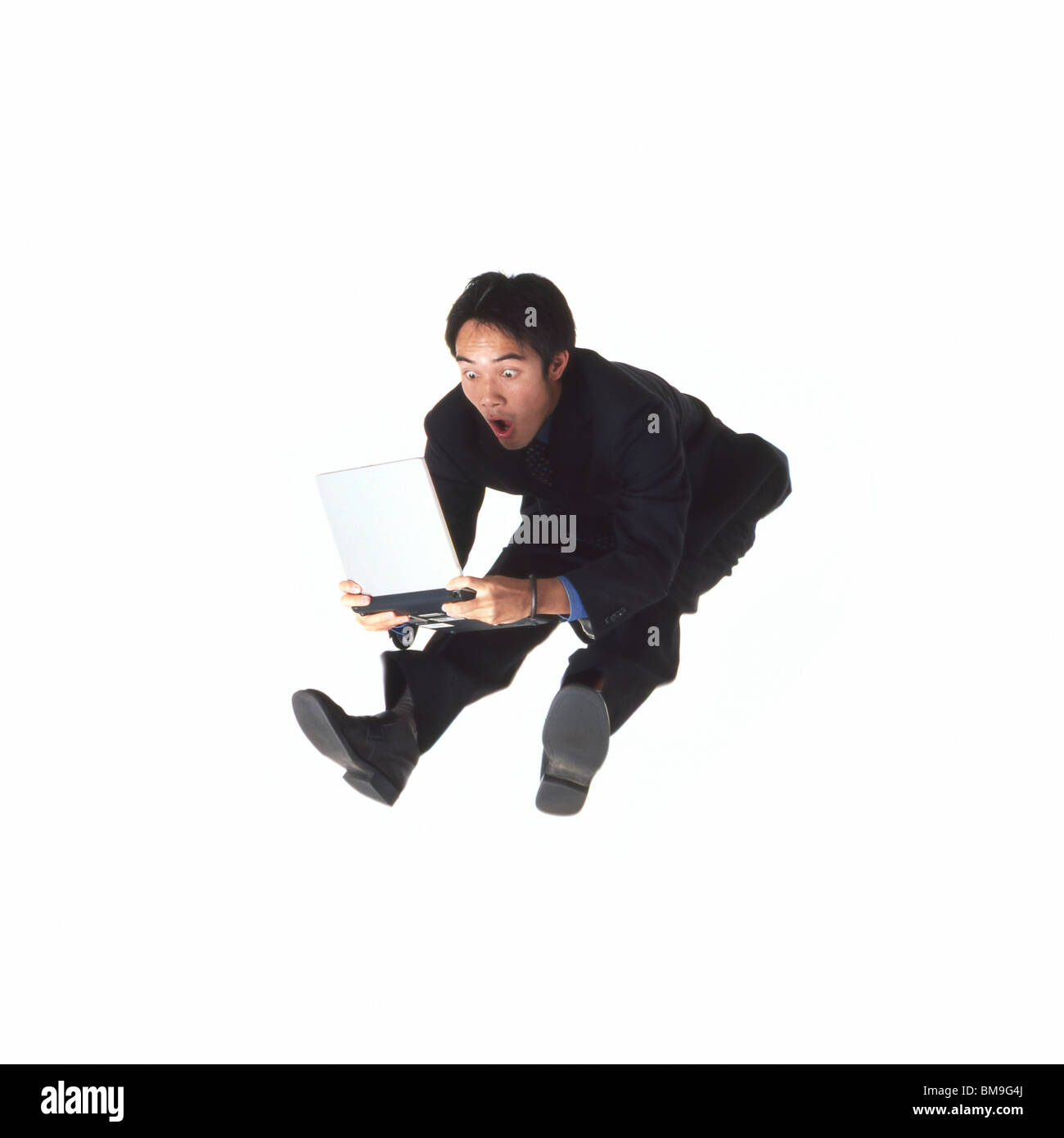 Man jumping using laptop hi-res stock photography and images - Alamy