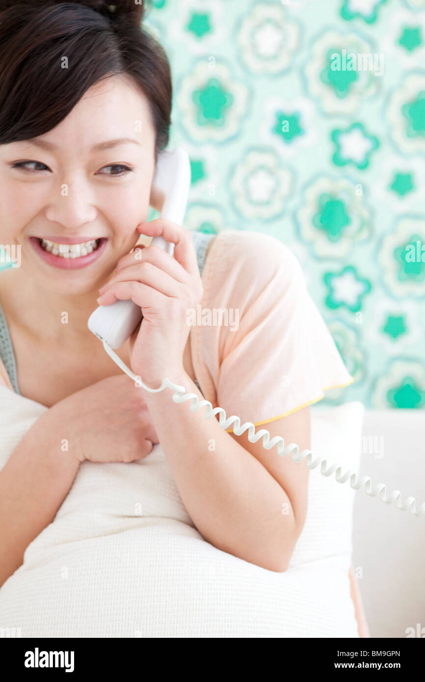 Young woman on telephone Stock Photo - Alamy