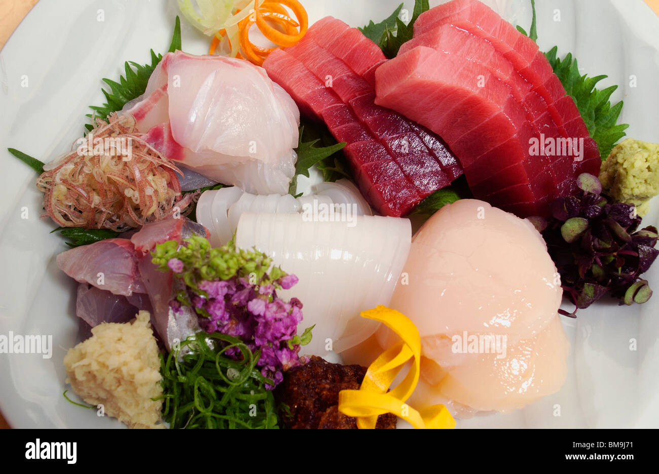 Plate of sliced fish, close up Stock Photo - Alamy