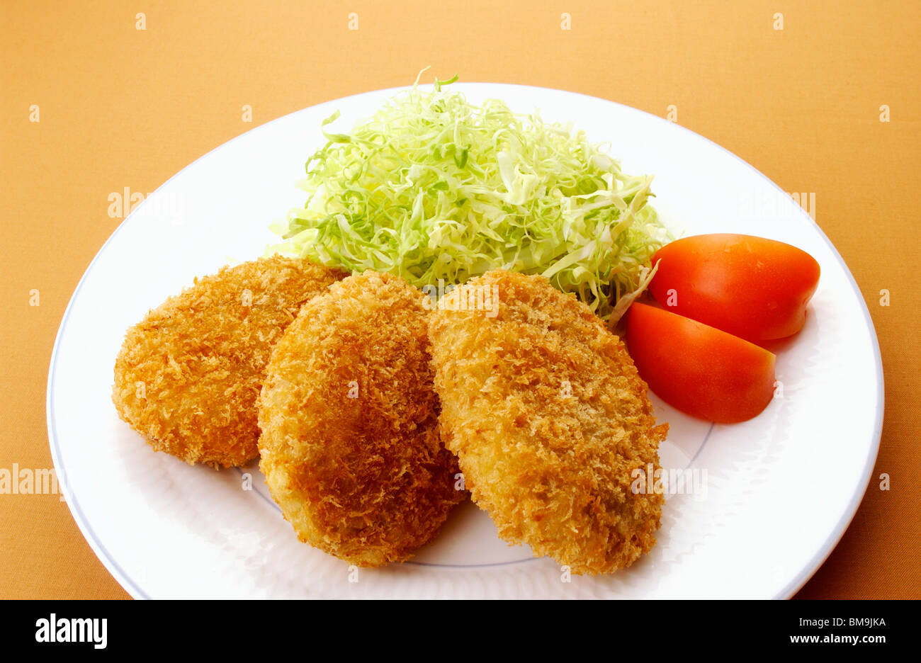 Plate of fried croquettes, colored background Stock Photo - Alamy
