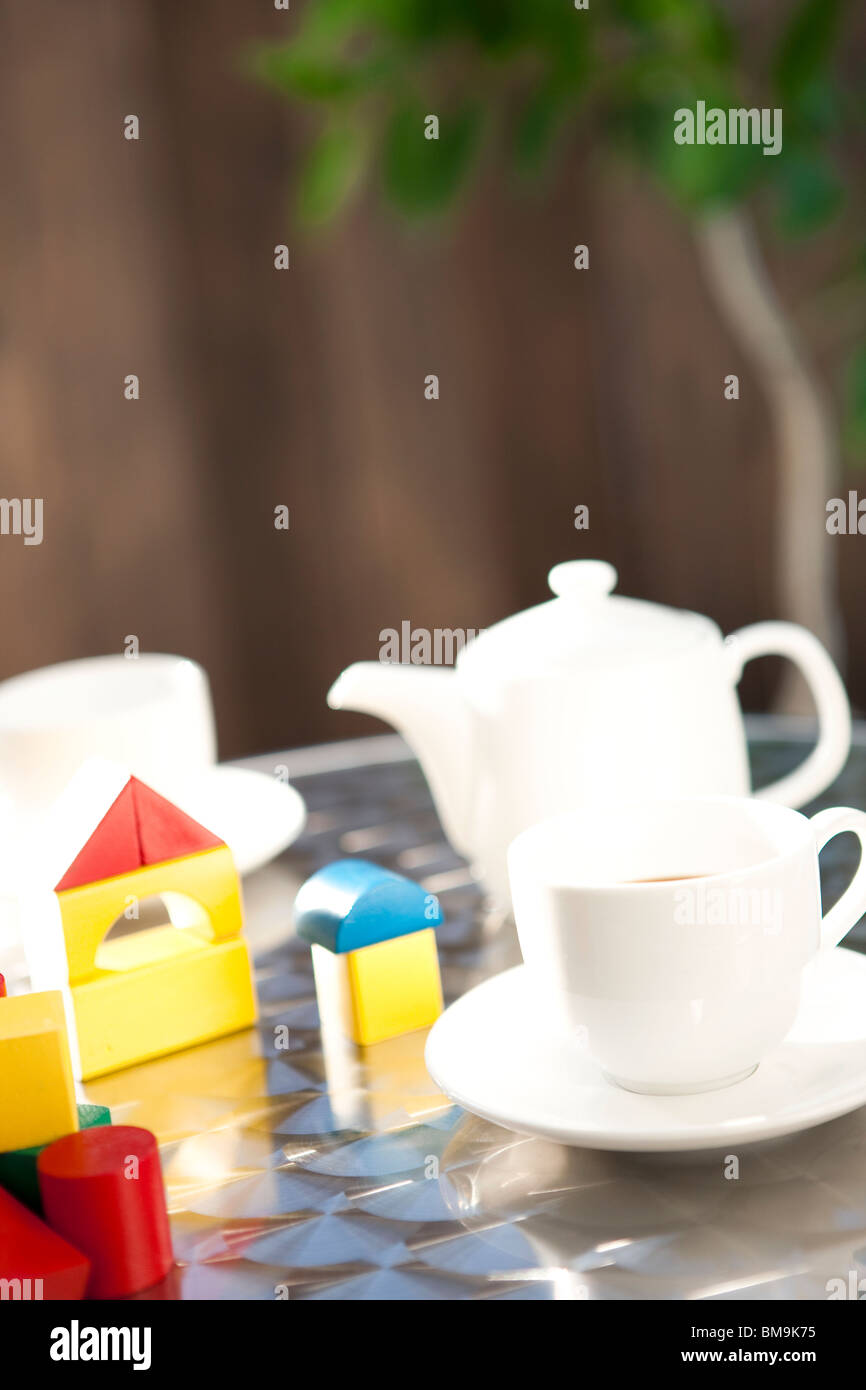 Wooden blocks and cups of coffee on table Stock Photo - Alamy