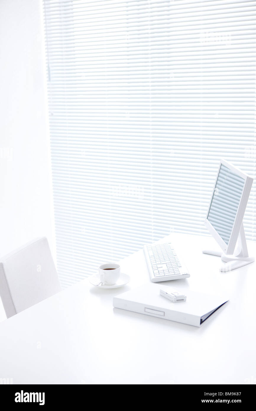 Computer and coffee cup on desk Stock Photo - Alamy