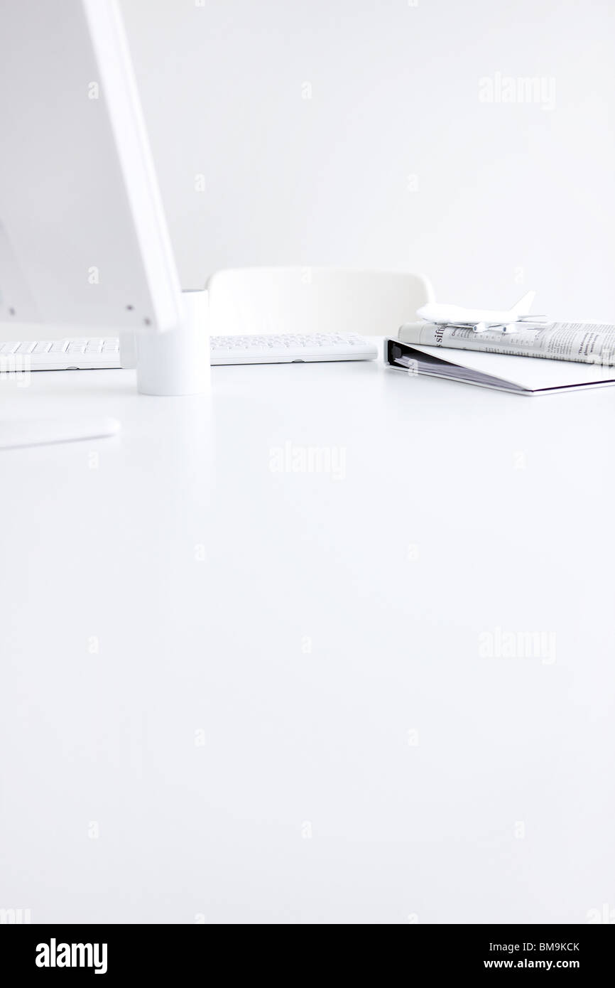 Computer and office supplies on desk in office, white background, copy ...