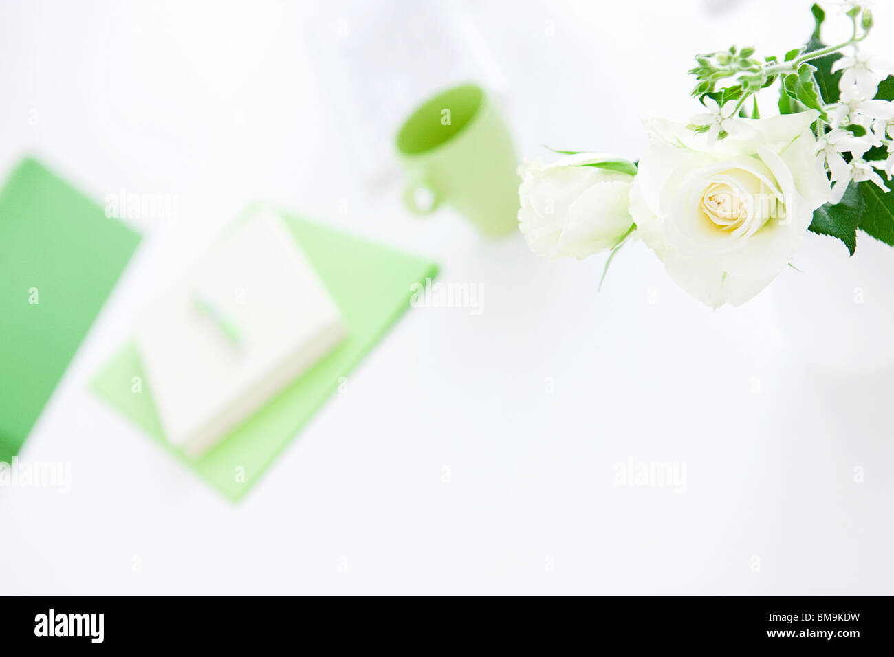 Vase of white roses on desk in office, differential focus Stock Photo ...