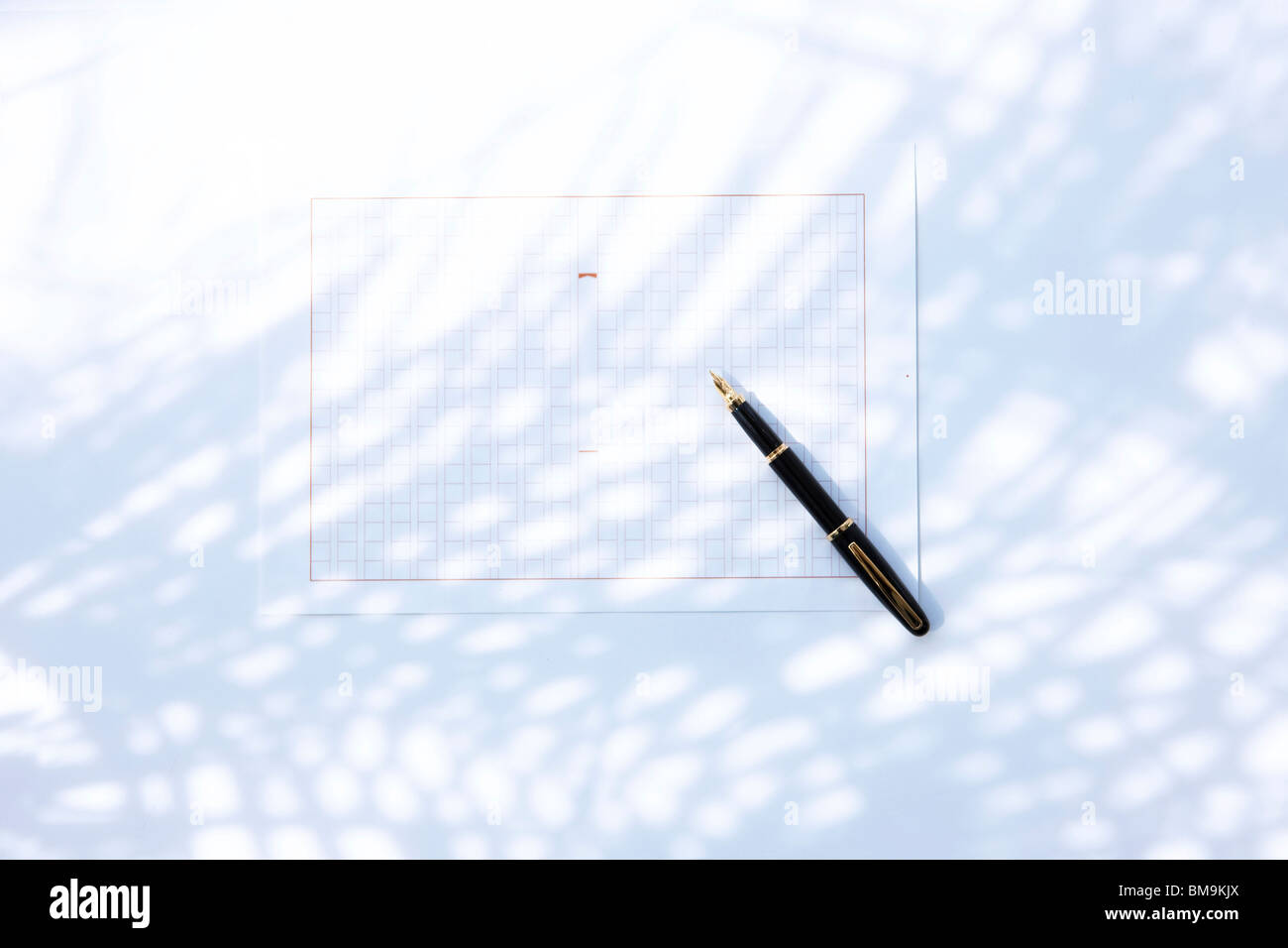 Fountain pen on paper, white background Stock Photo - Alamy