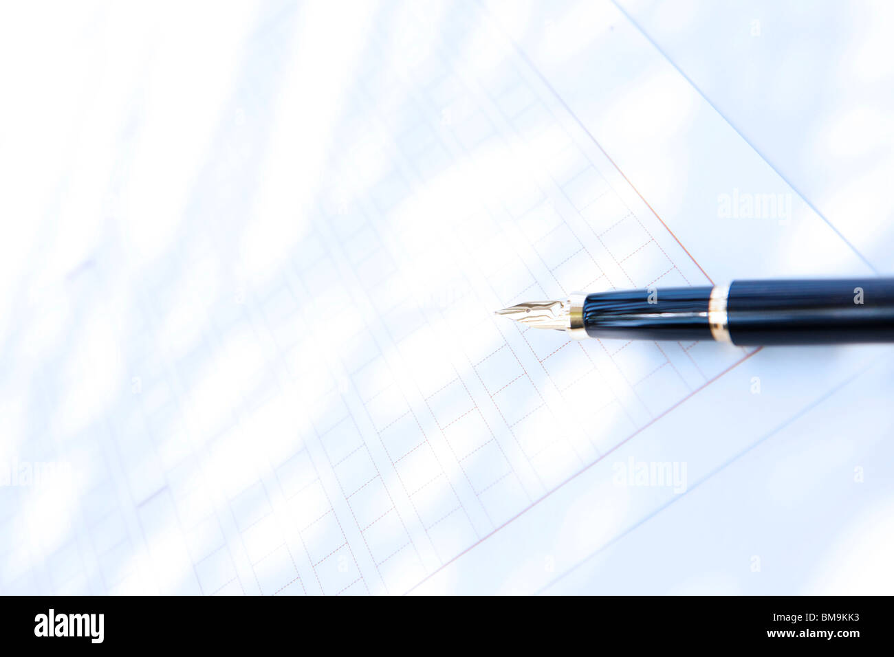 Fountain pen on paper, close up, white background Stock Photo - Alamy