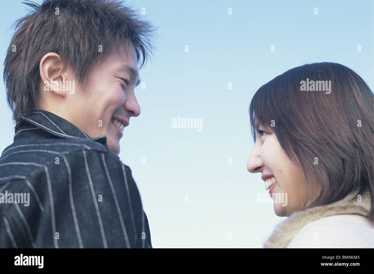 Young couple face to face Stock Photo - Alamy