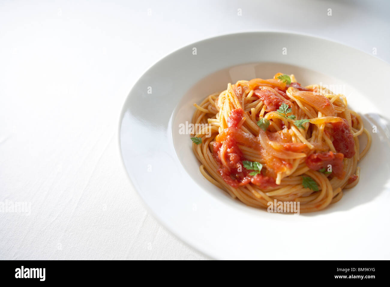 Plate of tomato spaghetti, white background Stock Photo - Alamy