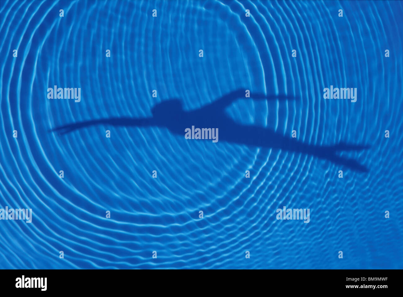 Rippled water and shadow of a person Stock Photo - Alamy