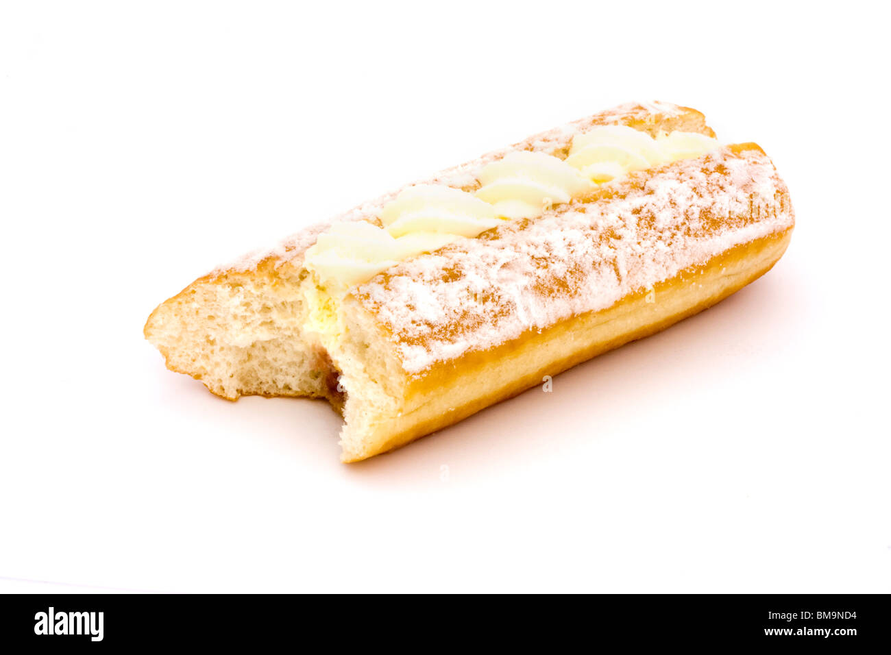 cream cake with a bite taken out on a white background Stock Photo - Alamy