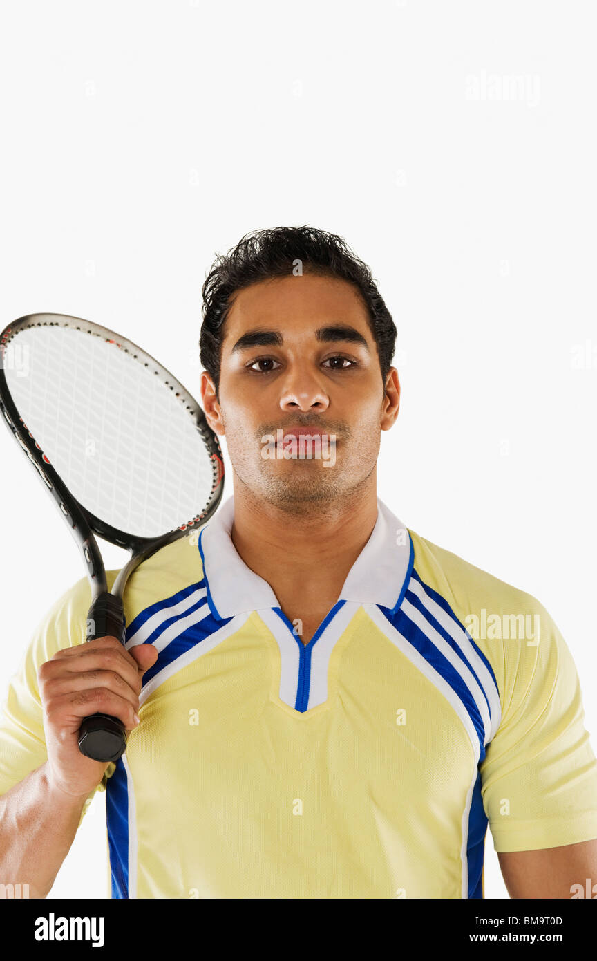 Man holding a tennis racket Stock Photo - Alamy
