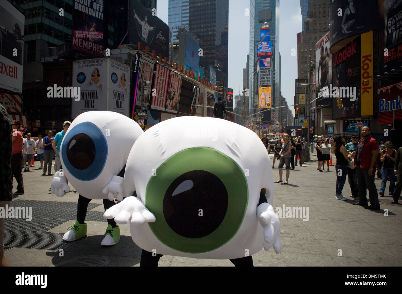 Dancers dressed in eyeball costumes dance and cavort in Times Square in ...