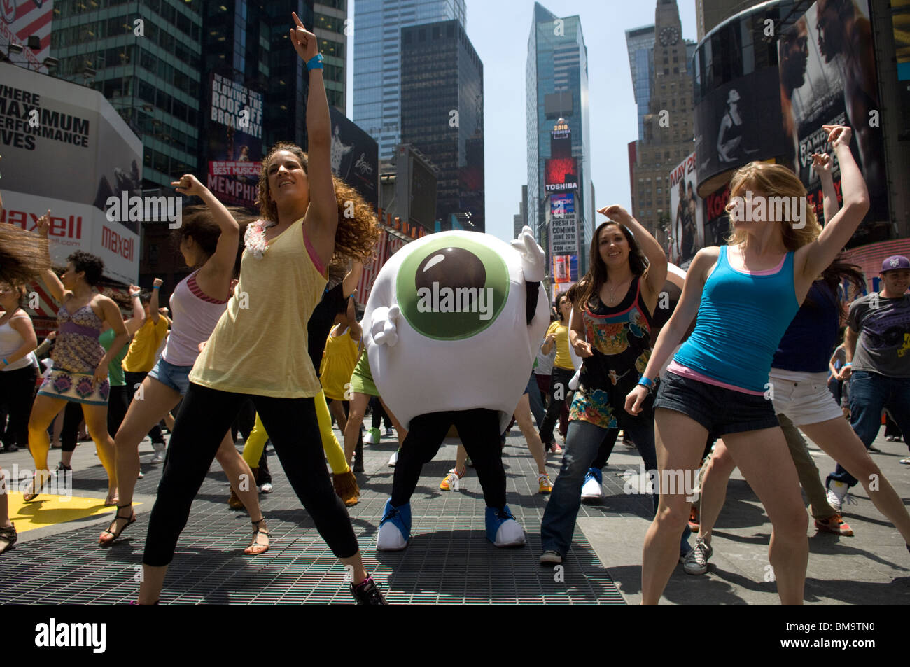 Dancers dressed in eyeball costumes dance and cavort in Times Square in ...