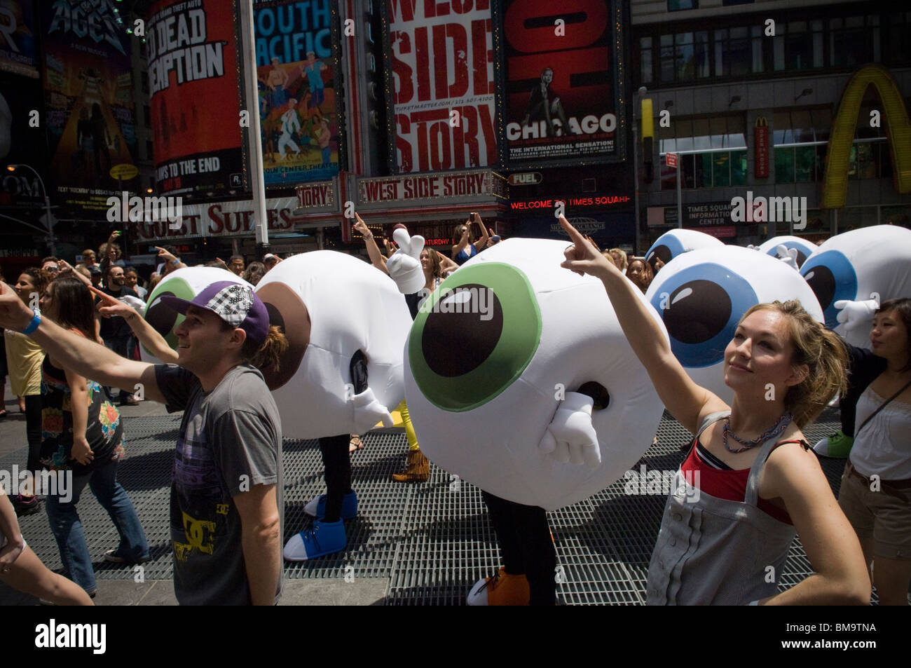 Dancers dressed in eyeball costumes dance and cavort in Times Square in ...