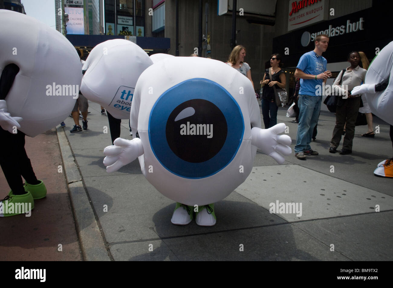 Dancers dressed in eyeball costumes dance and cavort in Times Square in ...