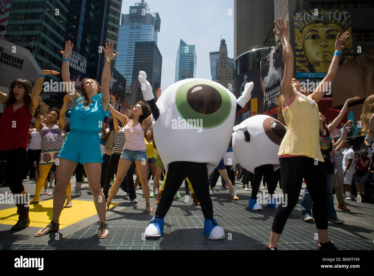 Dancers dressed in eyeball costumes dance and cavort in Times Square in ...