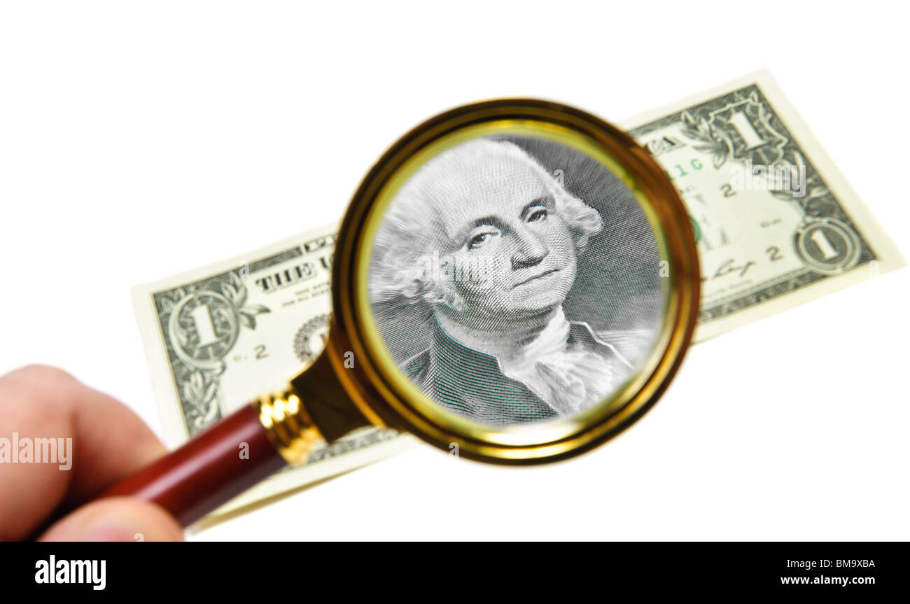 Dollar and magnifying glass isolated over white Stock Photo - Alamy