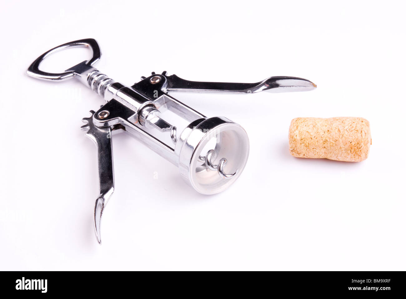 Cork and corkscrew on white background. Shot in studio Stock Photo - Alamy