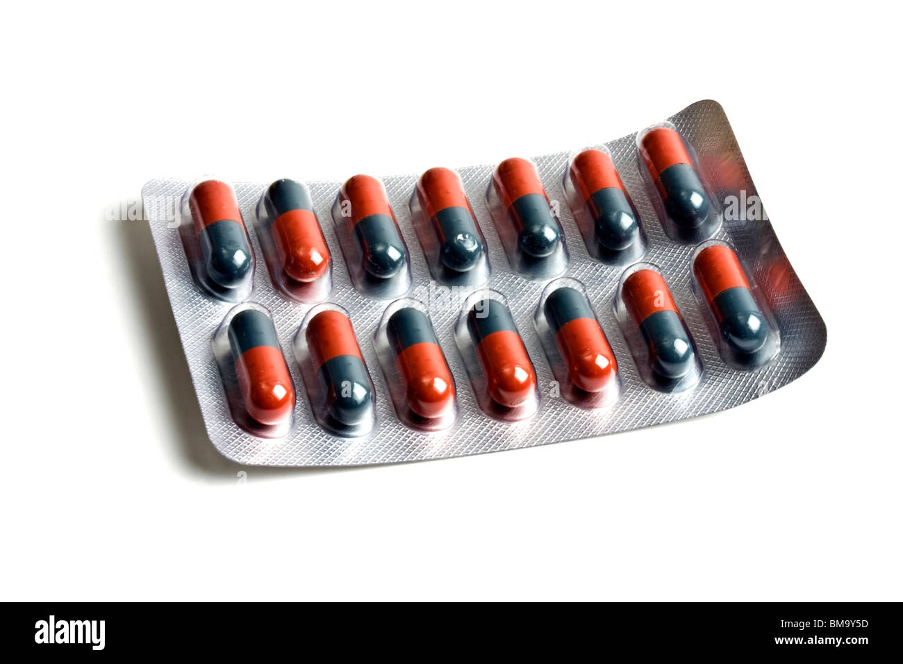 capsules packed in blister isolated on white Stock Photo - Alamy