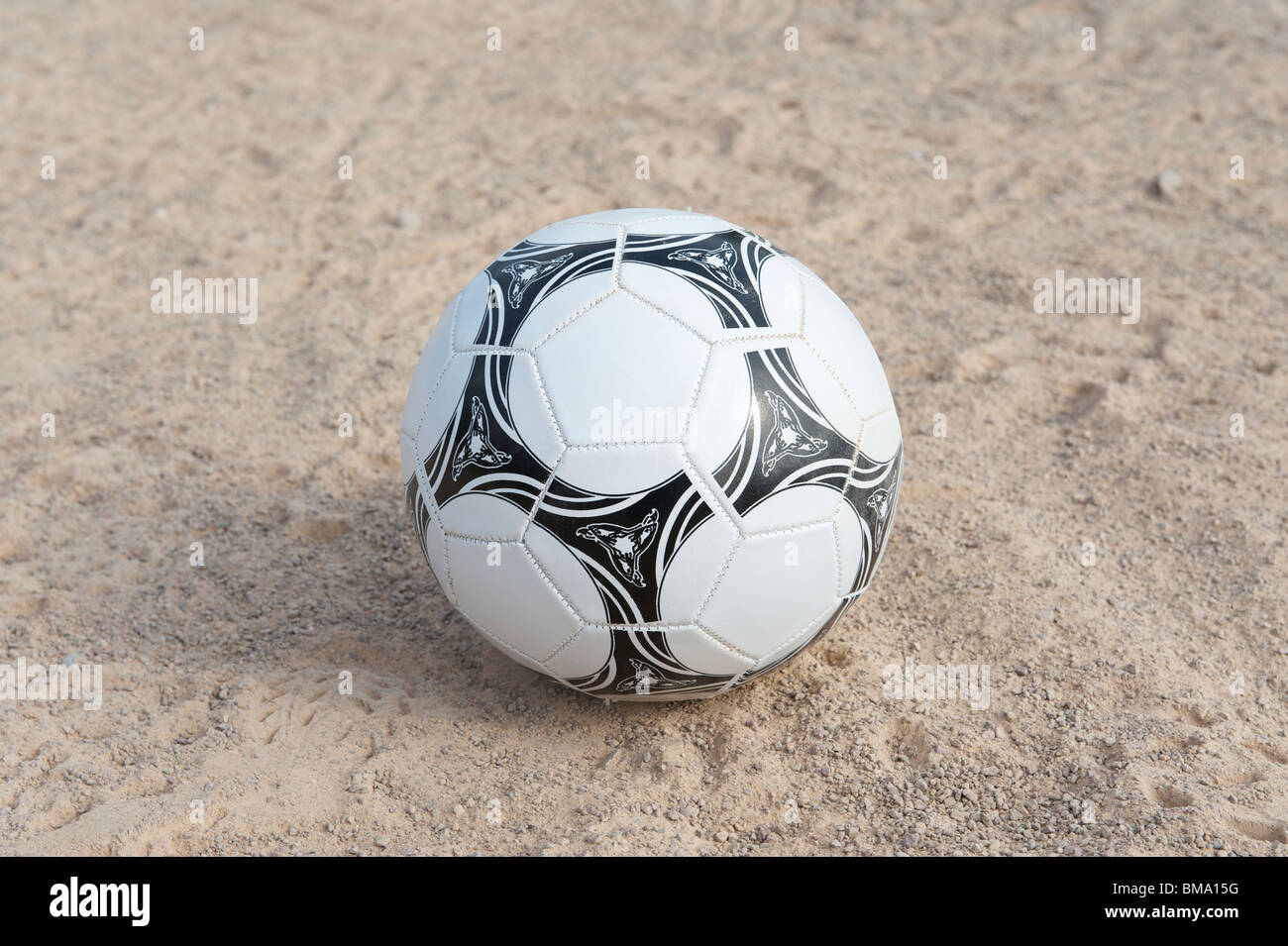 Football on sand Stock Photo - Alamy