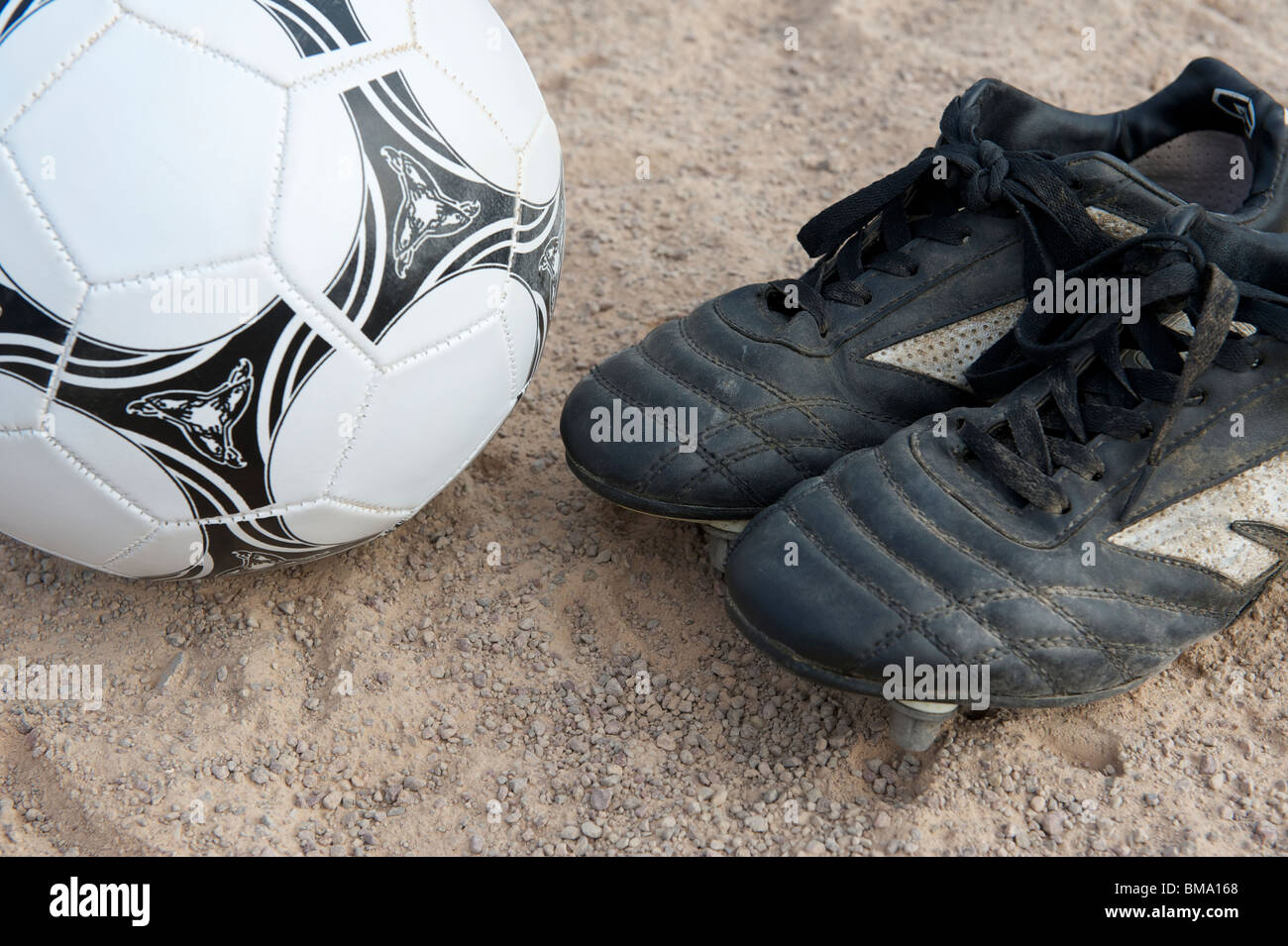 Football boots and ball Stock Photo - Alamy