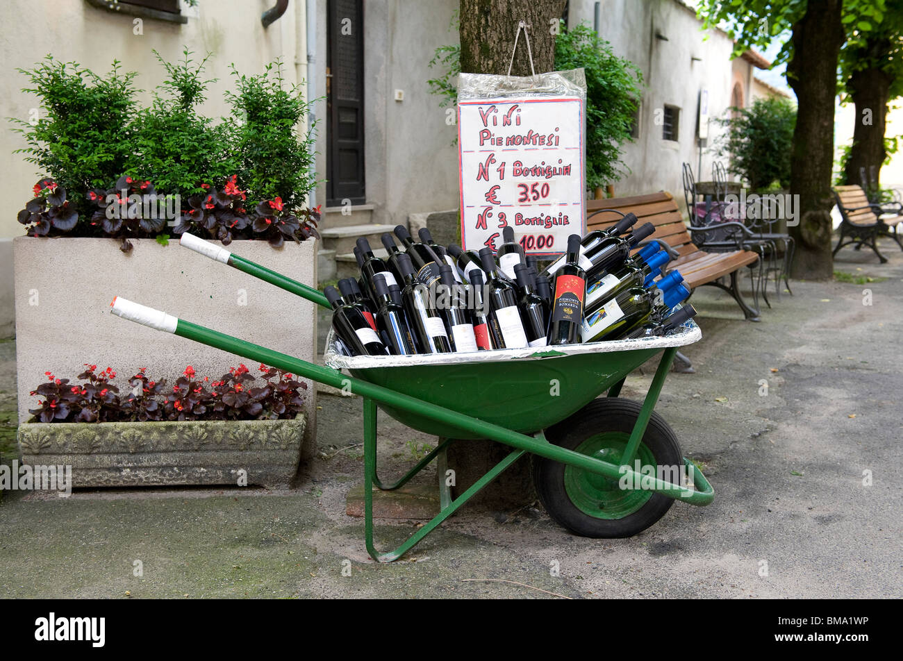 wheelbarrow full of wine bottles, lake orta, italy Stock Photo - Alamy