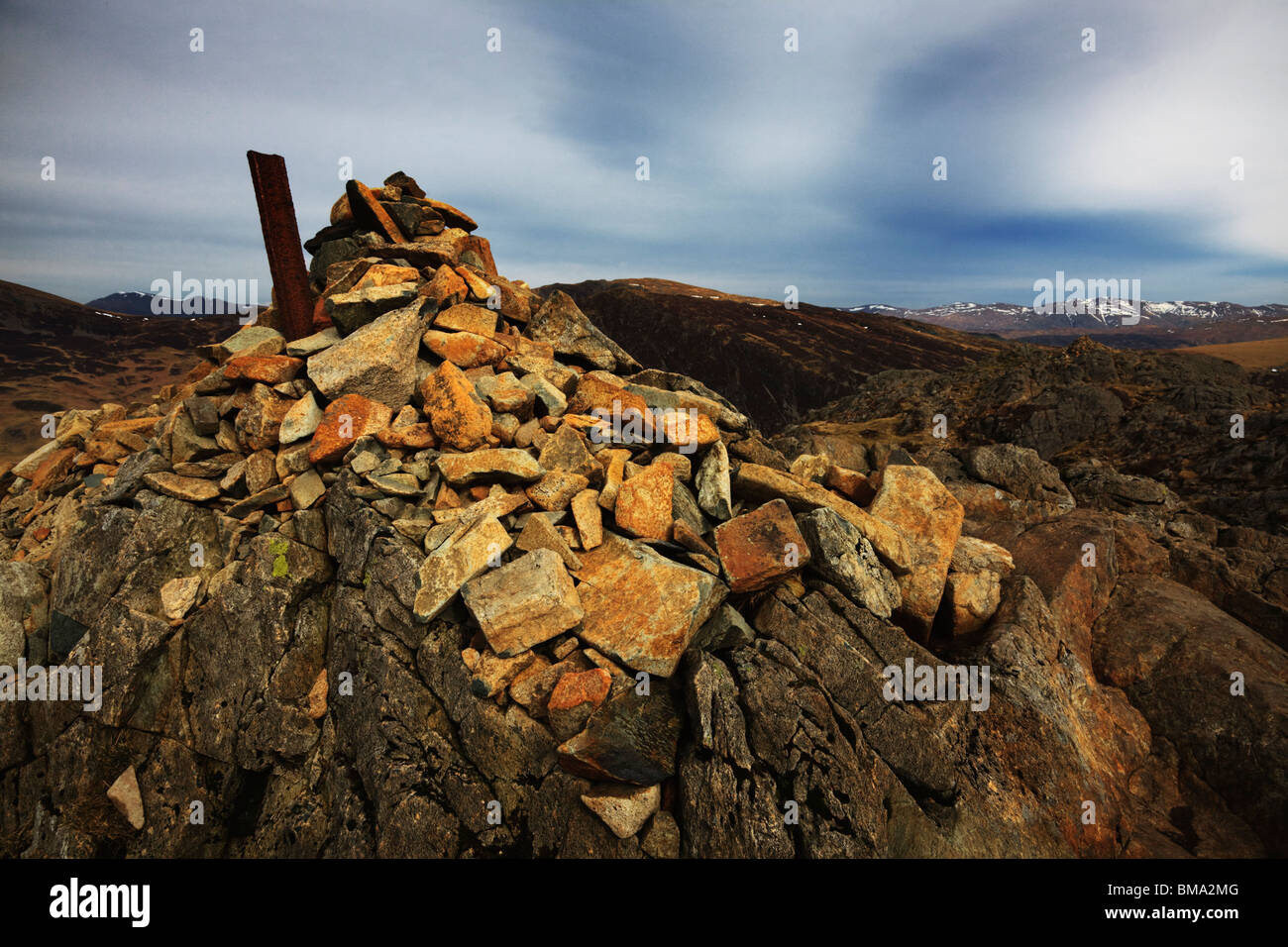 The summit cairn on Haystacks, Wainwright's favourite peak, brightly ...