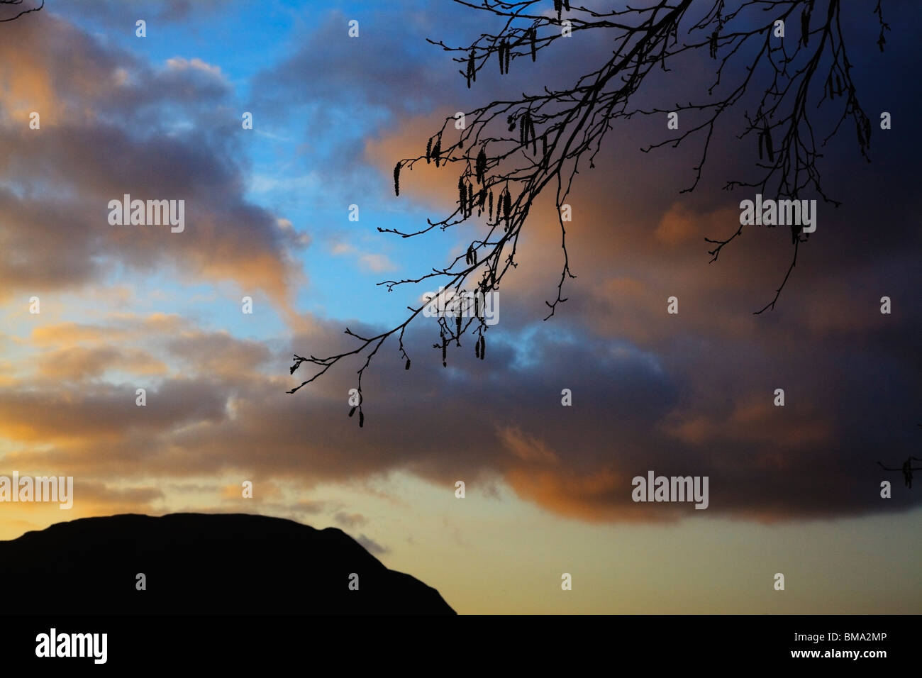 Sunset skyscape over Buttermere with vivid colours in the clouds and a ...
