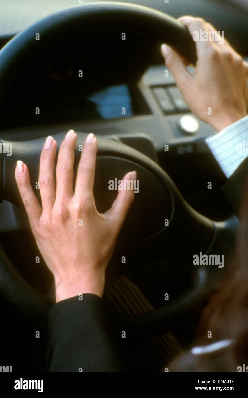 Woman's hands on car steering wheel Stock Photo - Alamy