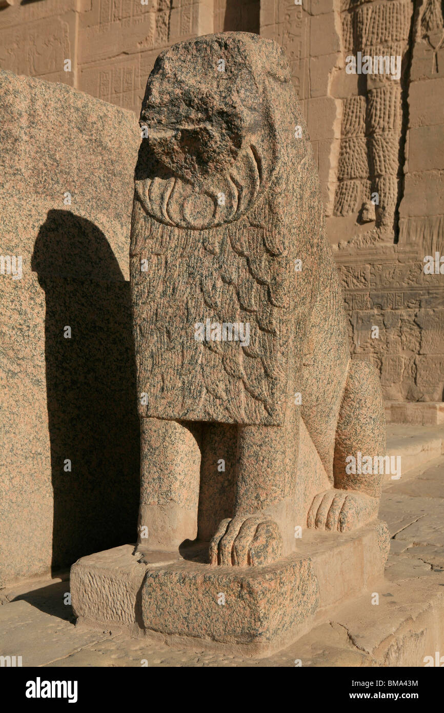Granite lion statue at the entrance of the first pylon of the Temple of ...