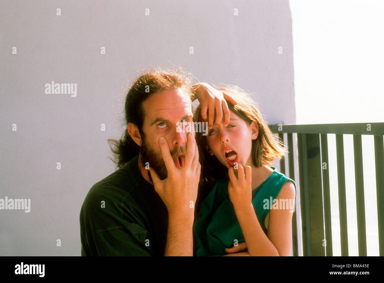 Father and daughter making faces Stock Photo - Alamy