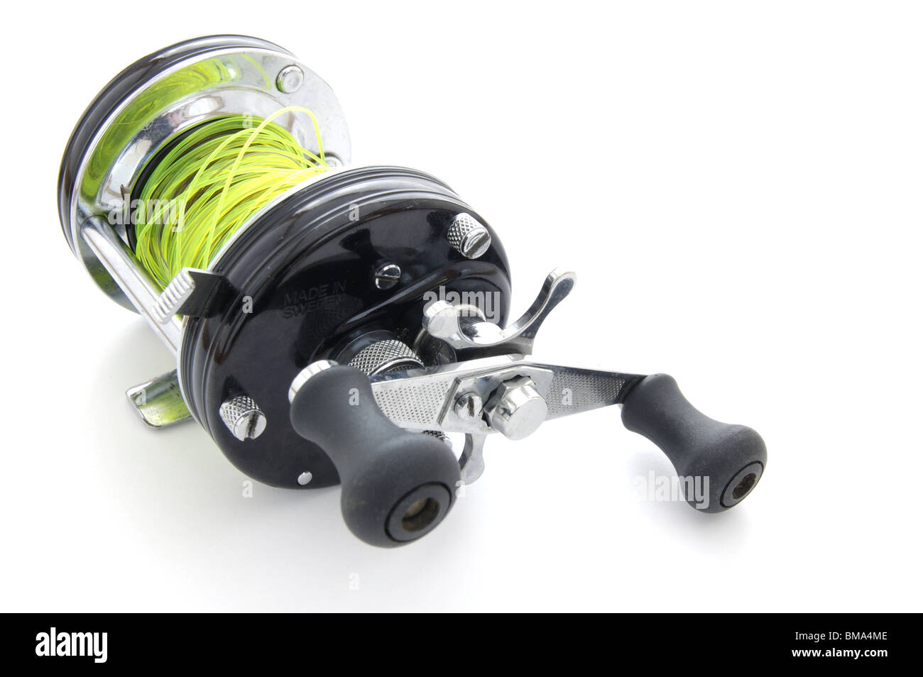 Sea fishing multiplier reel isolated on a white background Stock Photo ...