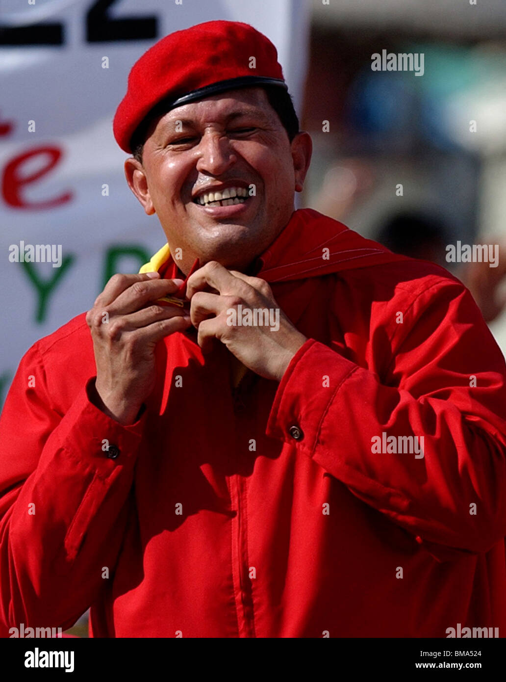 Venezuela's President Hugo Chavez wearing his iconic red beret smiles ...