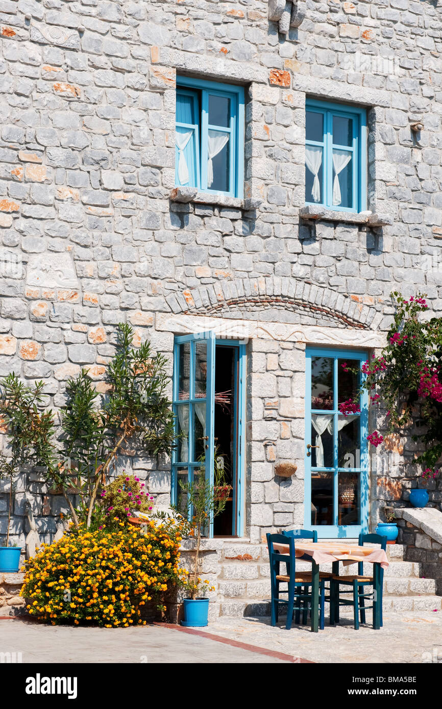 Greek house with garden and terrace and blue furniture Stock Photo - Alamy